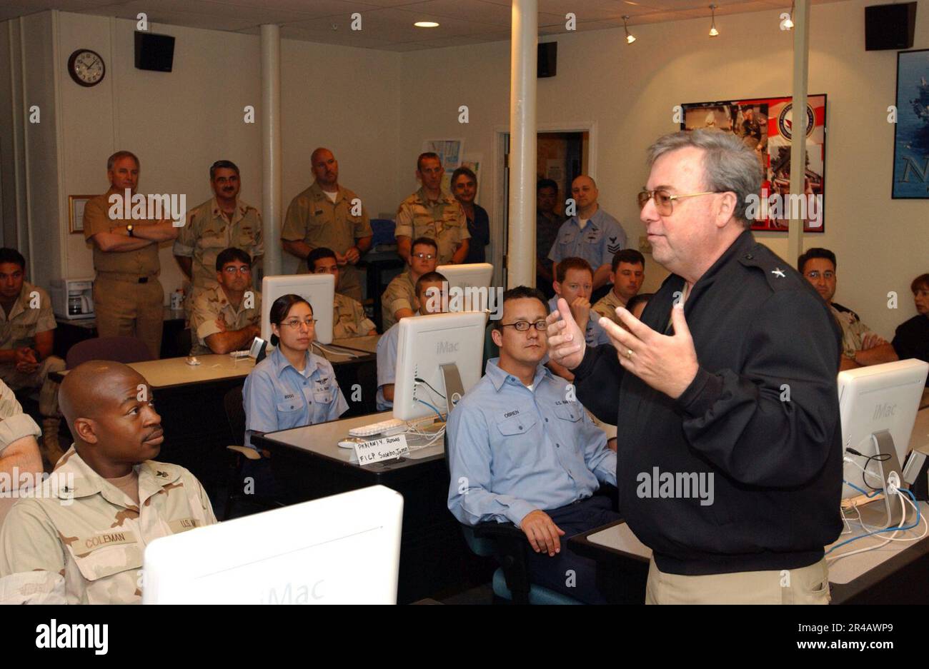 US Navy Chief of Information, Rear Adm. T. L. McCreary, speaks to ...