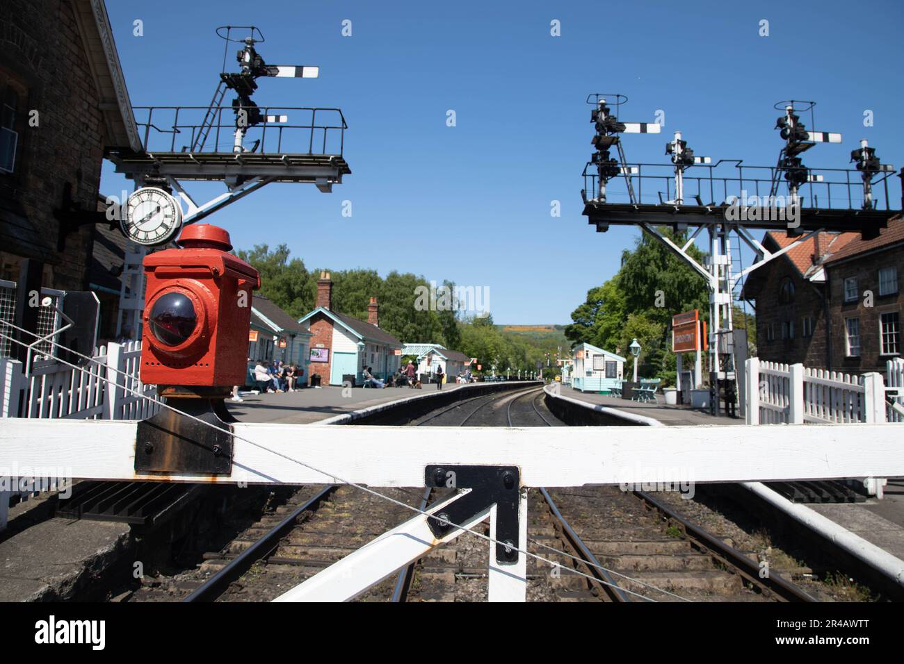 A scenic view of a railway track running through a valley on a sunny ...