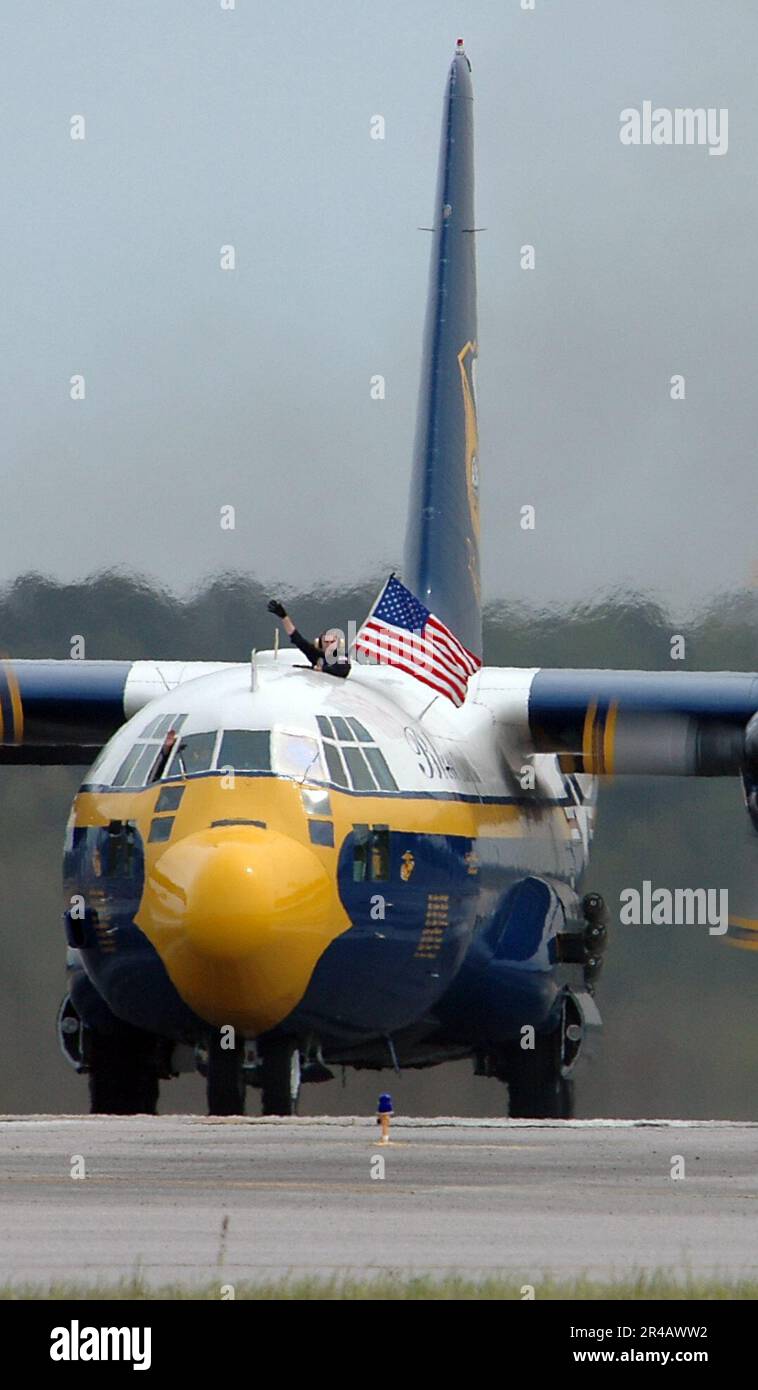 US Navy A crew member aboard the U.S. Marine Corps C-130 Hercules Fat ...
