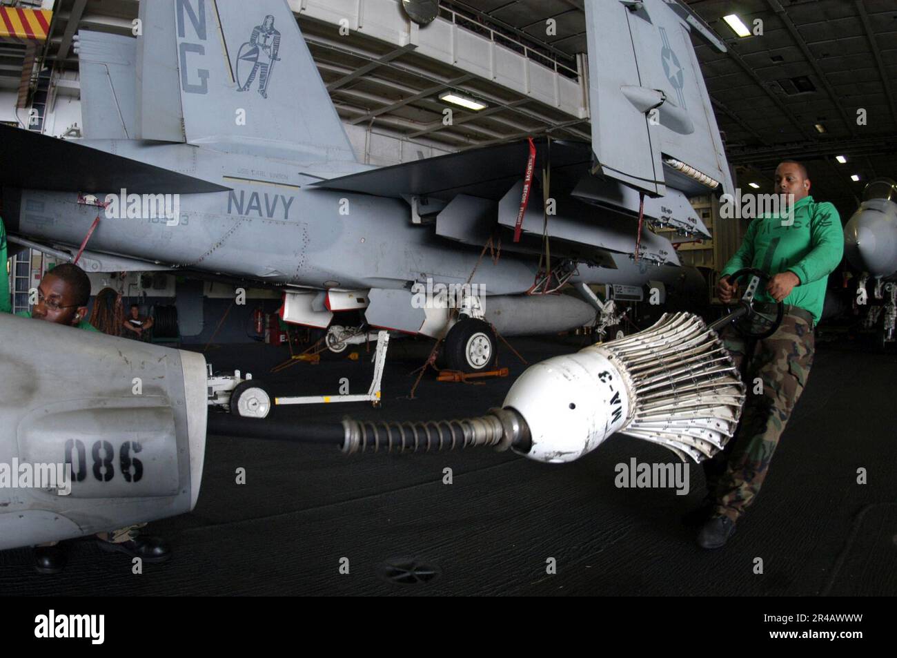 US Navy Aviation Machinist's Mate 2nd Class pulls out the refueling ...
