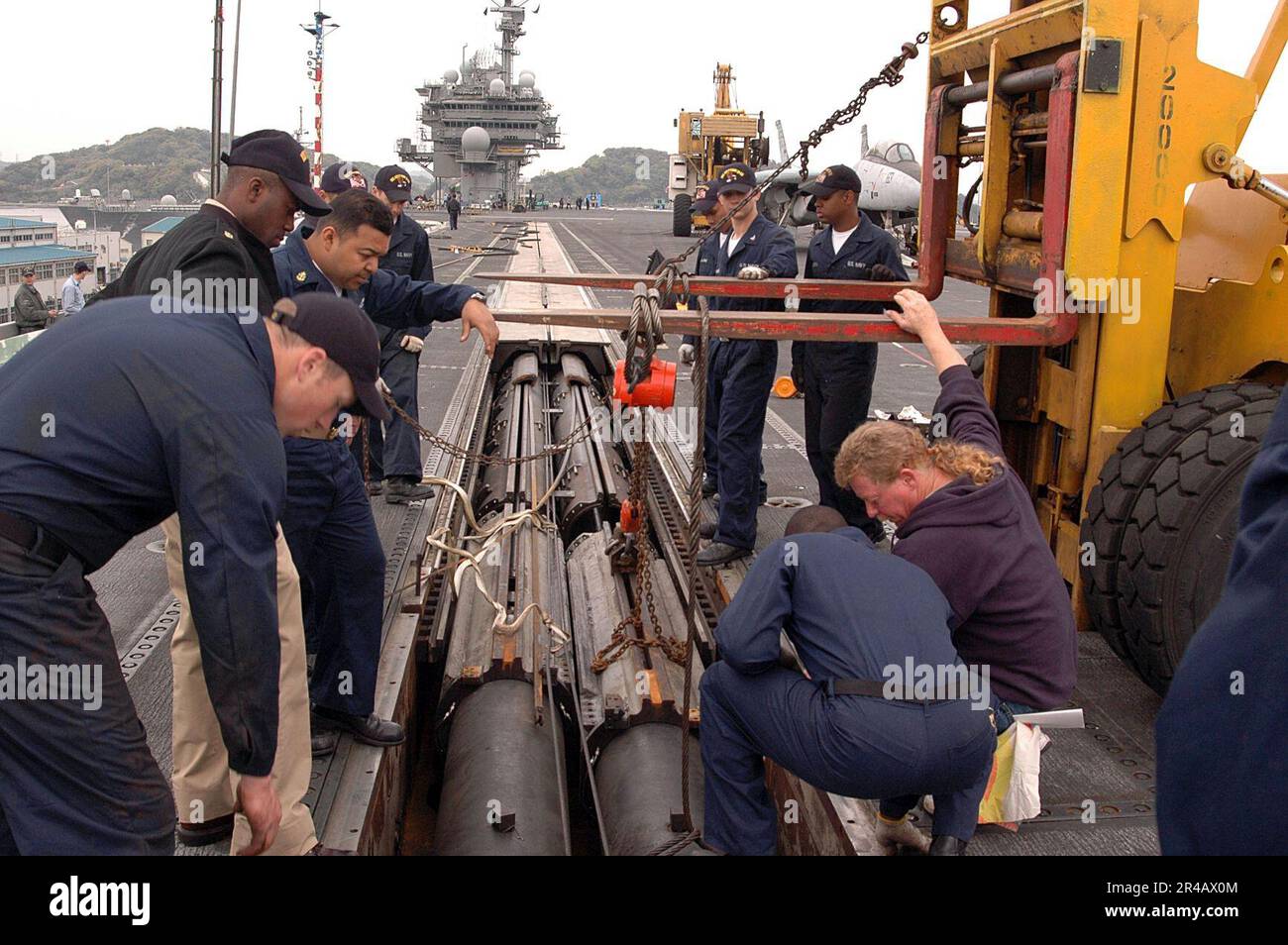 US Navy Sailors assigned to the Air Department, conduct maintenance on ...
