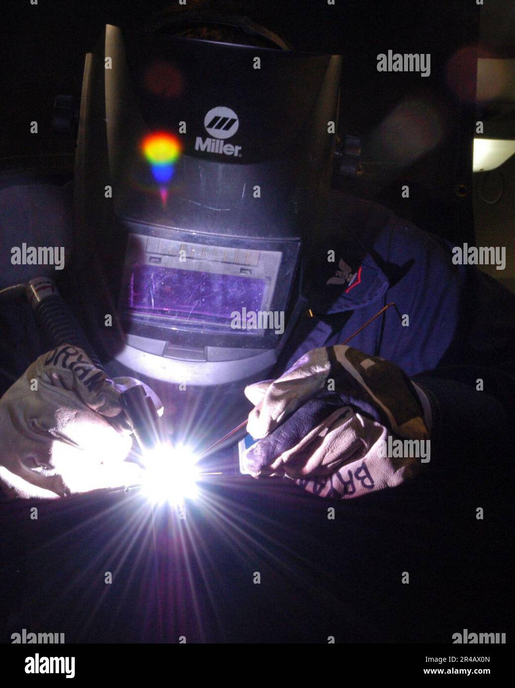 US Navy Hull Maintenance Technician 3rd Class assigned to the ...