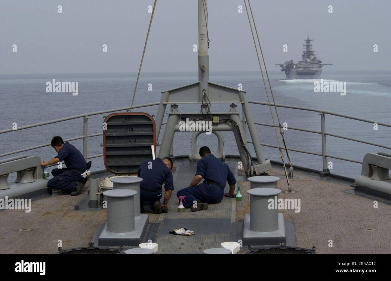 US Navy Crew members assigned to amphibious transport dock ship USS ...