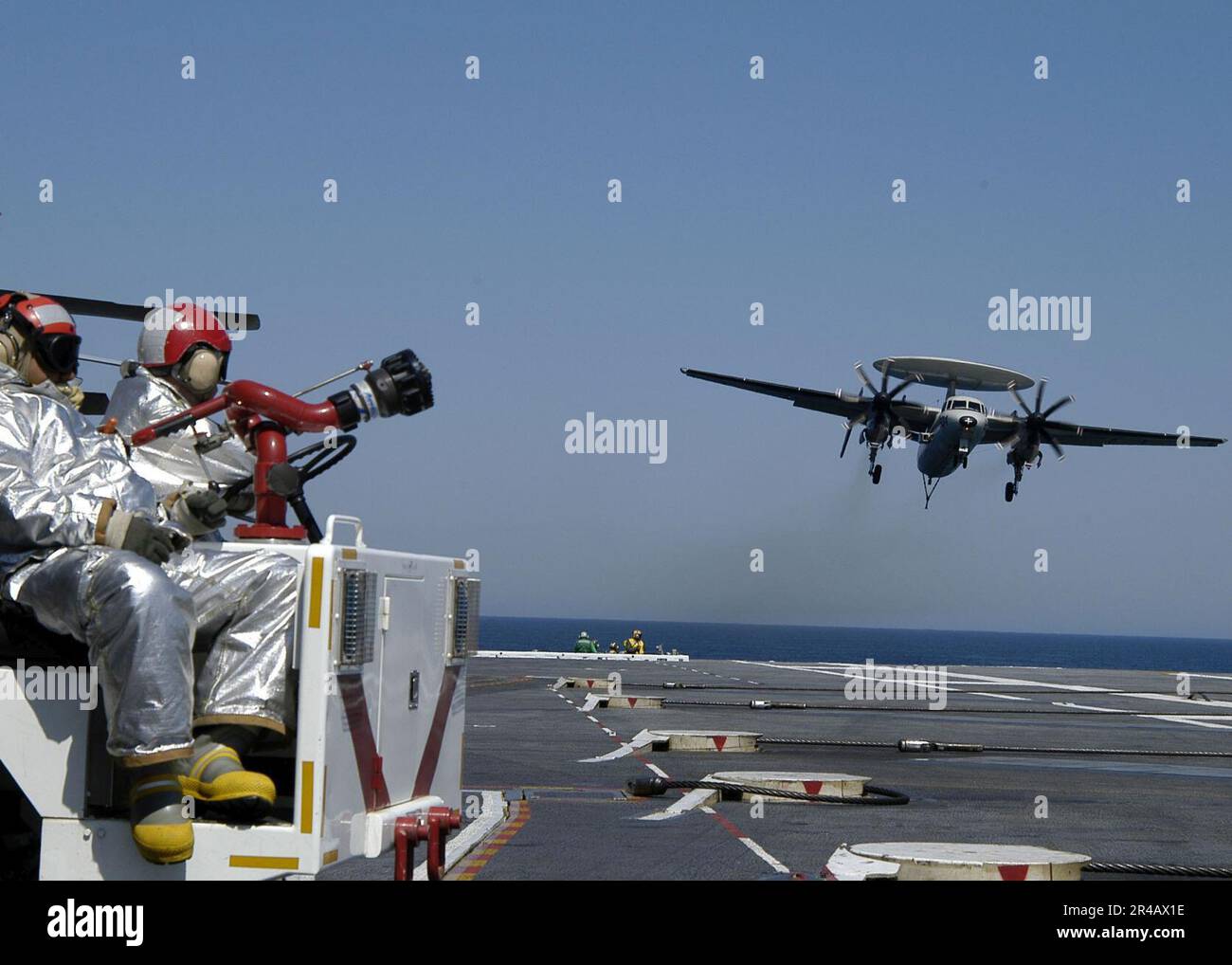 US Navy Sailors assigned to the Crash and Salvage Division aboard the ...