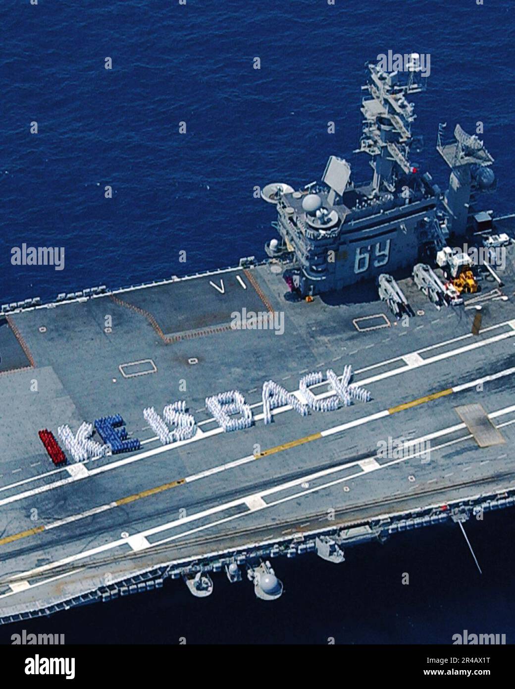 US Navy Crewmembers aboard the Nimitz-class aircraft carrier USS Dwight ...