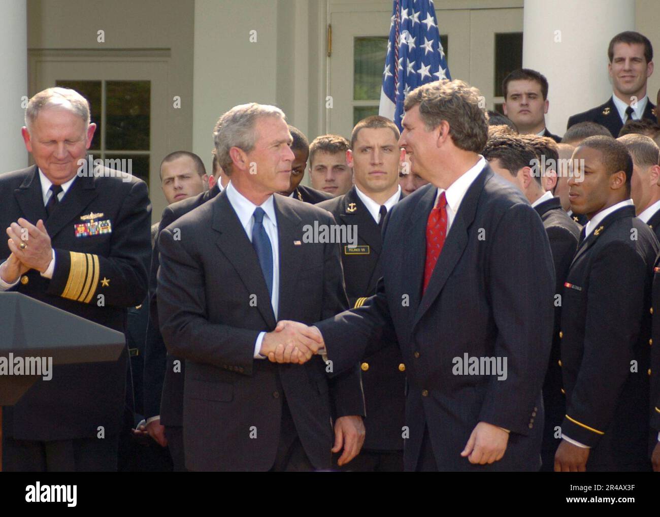 US Navy President George W. Bush shakes hands with U.S. Naval Academy ...