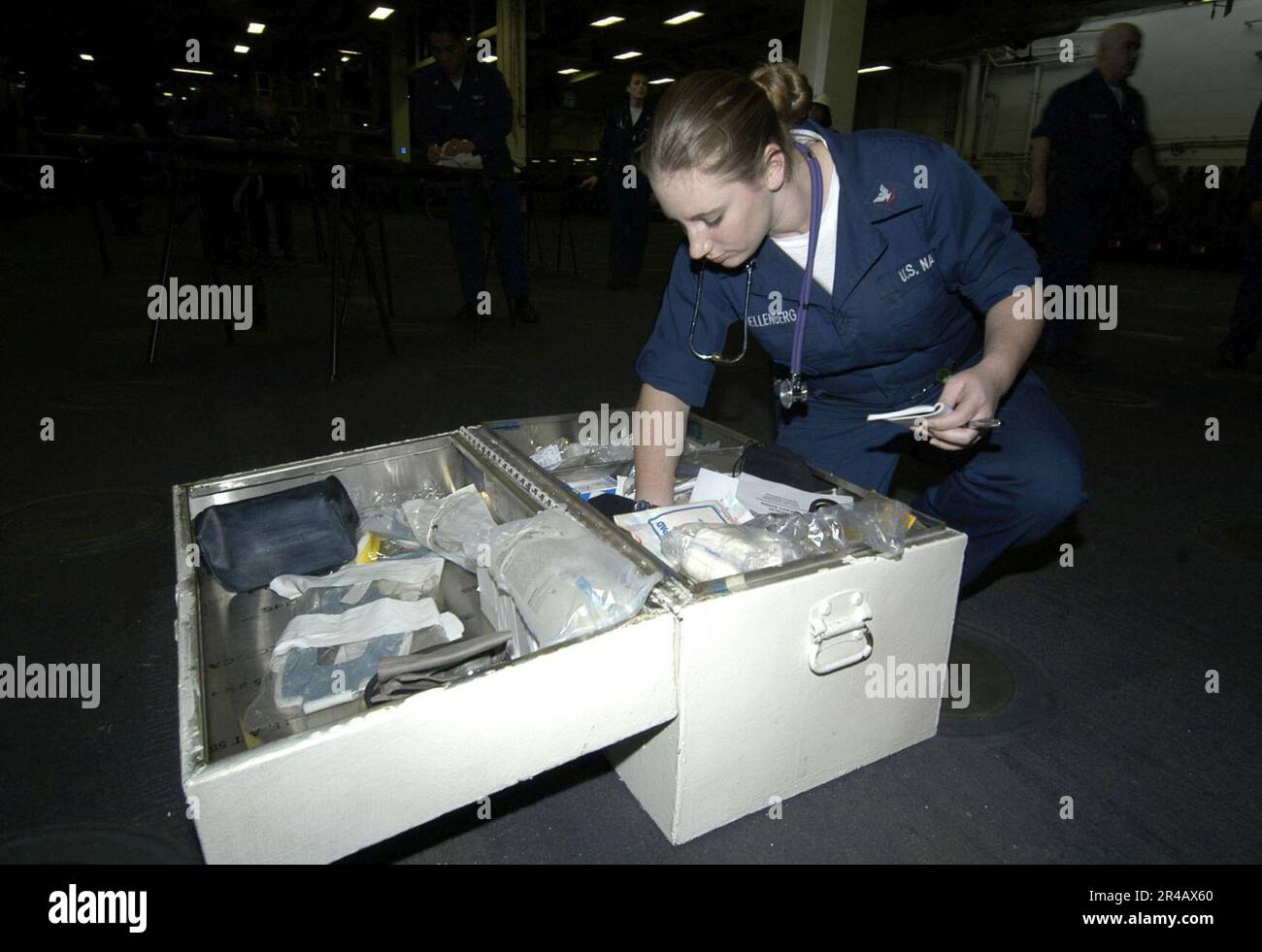 US Navy A Hospital Corpsman takes some needed supplies from a medical ...