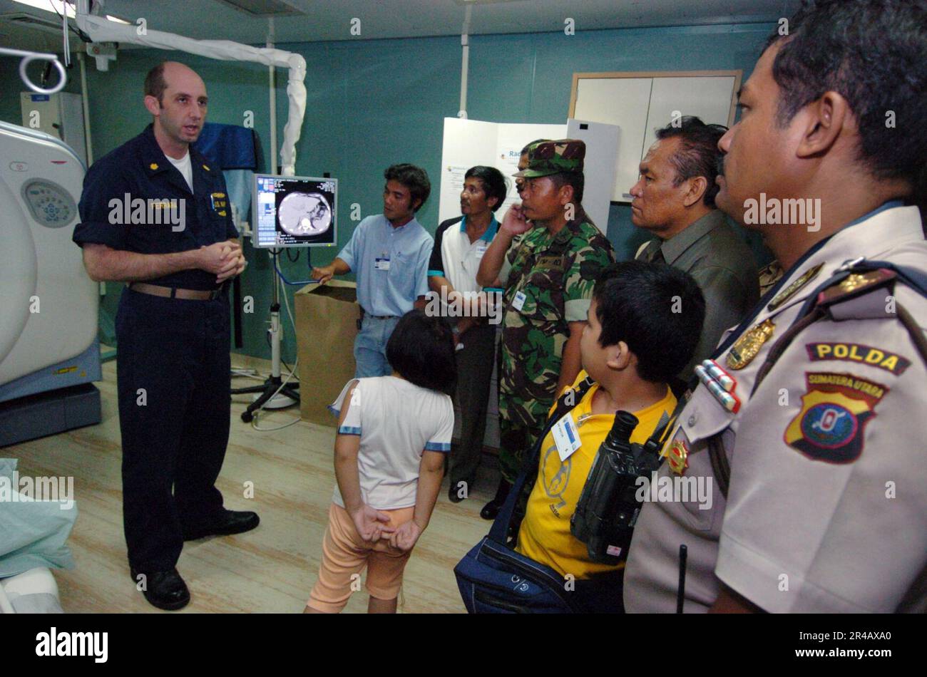 US Navy Lt. shows distinguished visitors from Indonesia the Computed ...
