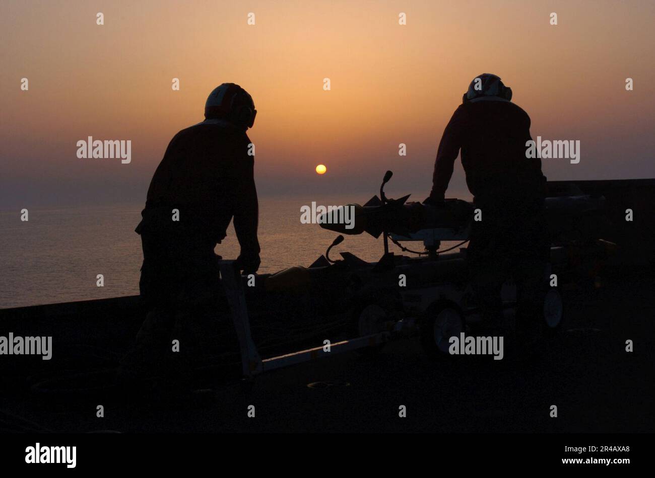 US Navy Aviation ordnancemen move Carrier Air Training Missiles (CATMs ...