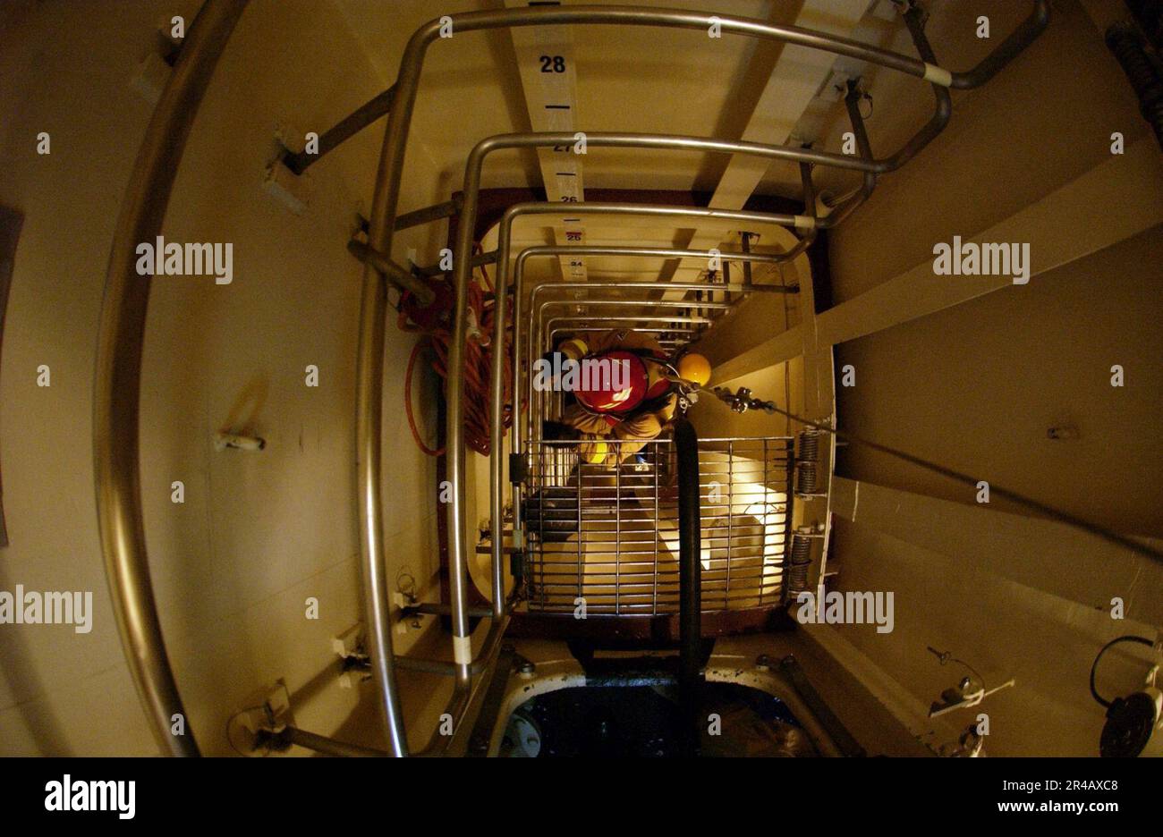 US Navy A crew member assigned a repair locker aboard the guided ...