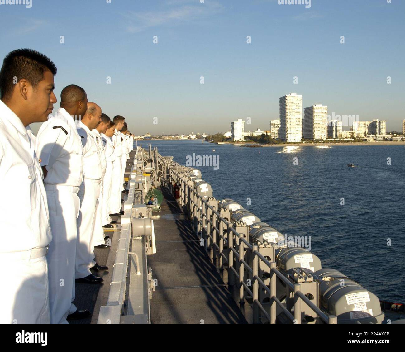 US Navy Sailors man the rails as the amphibious assault ship USS Bataan ...