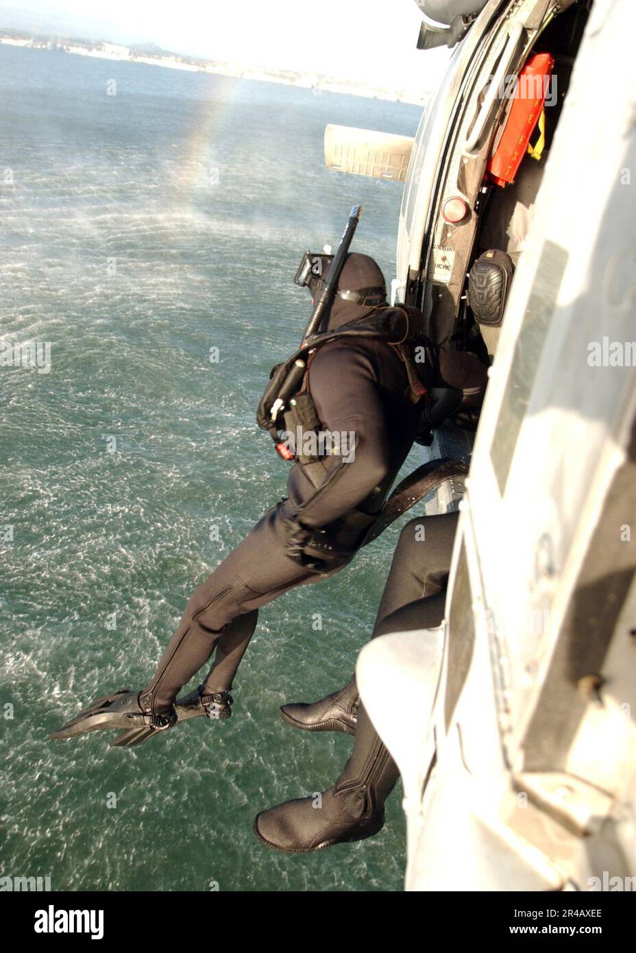 US Navy A search and rescue swimmer student jumps from a MH-60S Seahawk ...