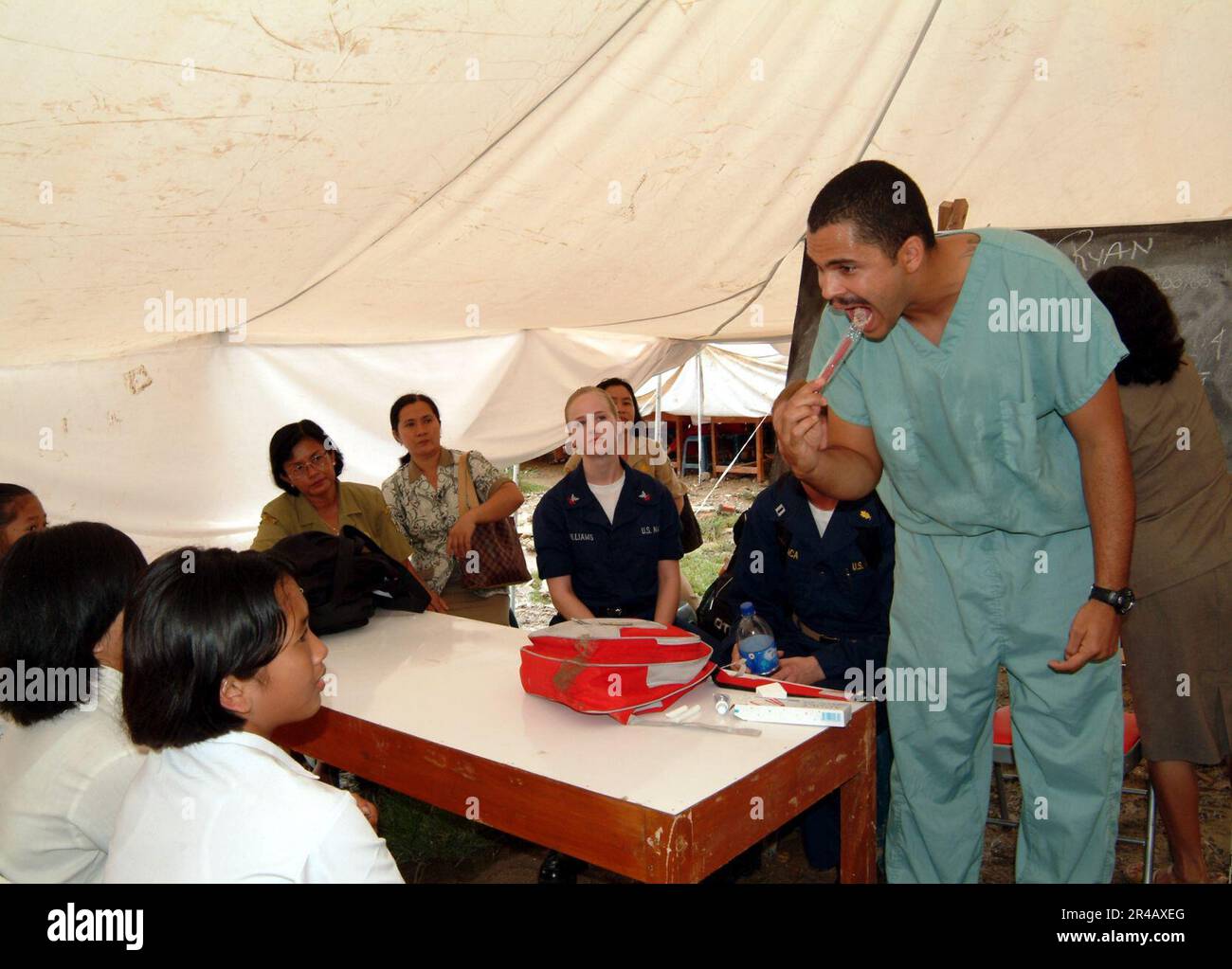 US Navy Dental Technician 3rd Class teaches students the proper use of ...