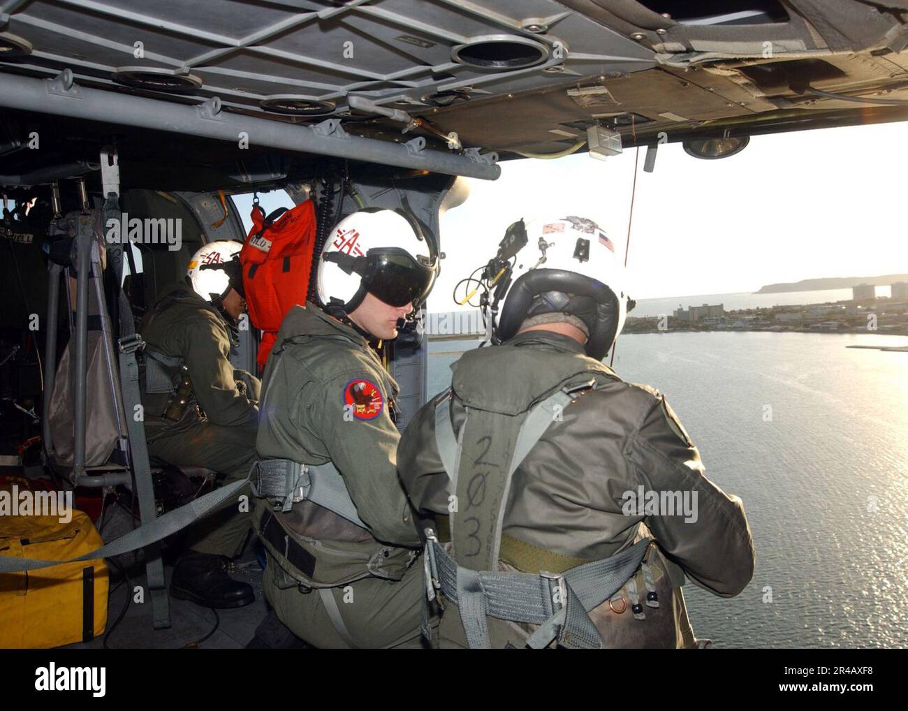 US Navy Aviation Structural Mechanic 3rd Class left, learns how to ...