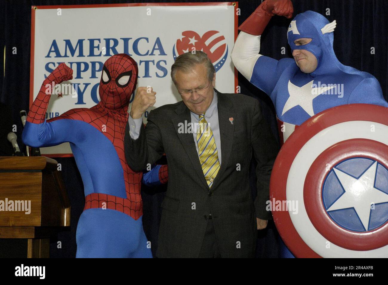 US Navy Secretary of Defense Donald Rumsfeld flexes his muscles with ...
