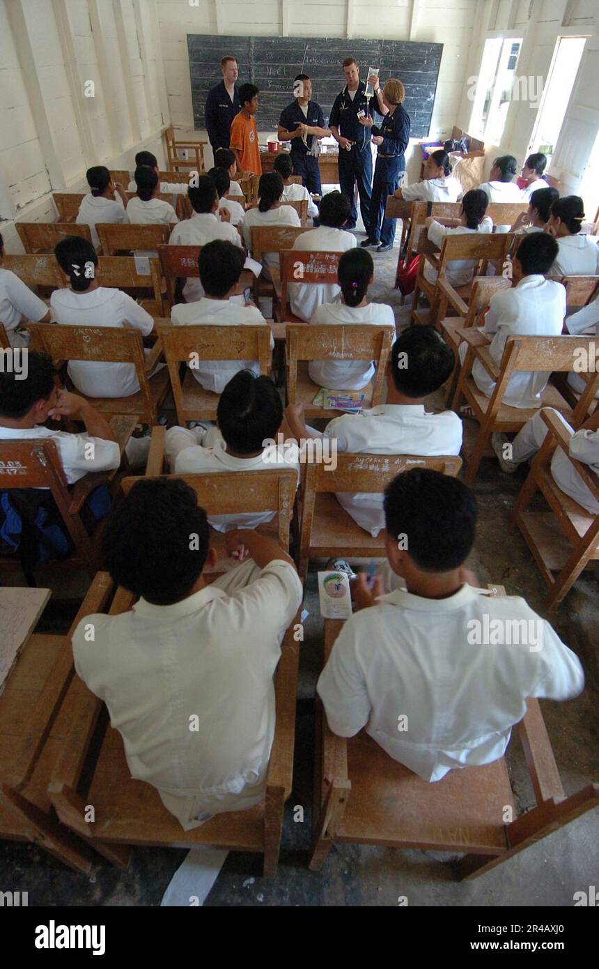 US Navy Cmdr. and other Sailors assigned to the Military Sealift Command (MSC) hospital ship ...