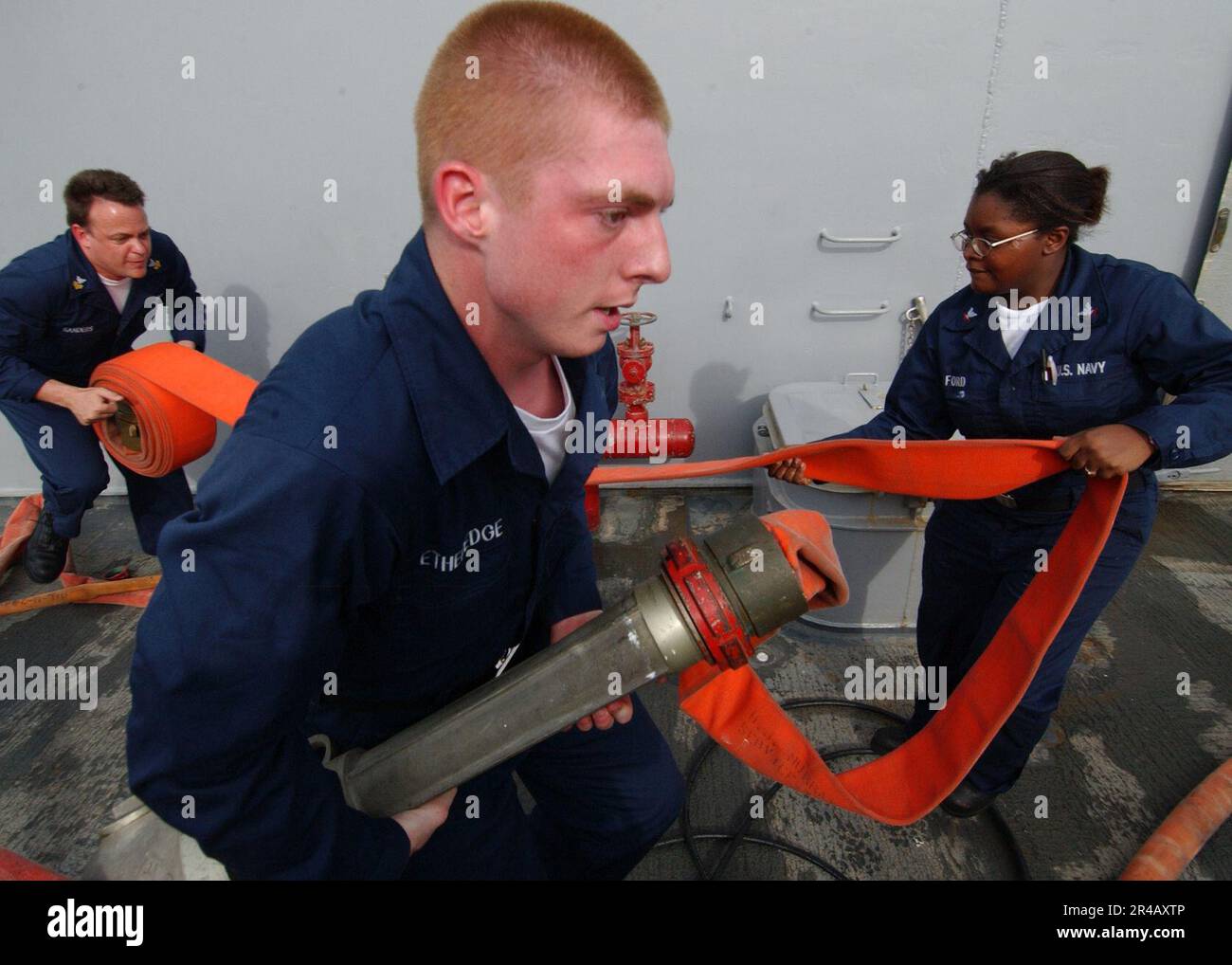 US Navy Operations Specialist Seaman center, assigned to the ...