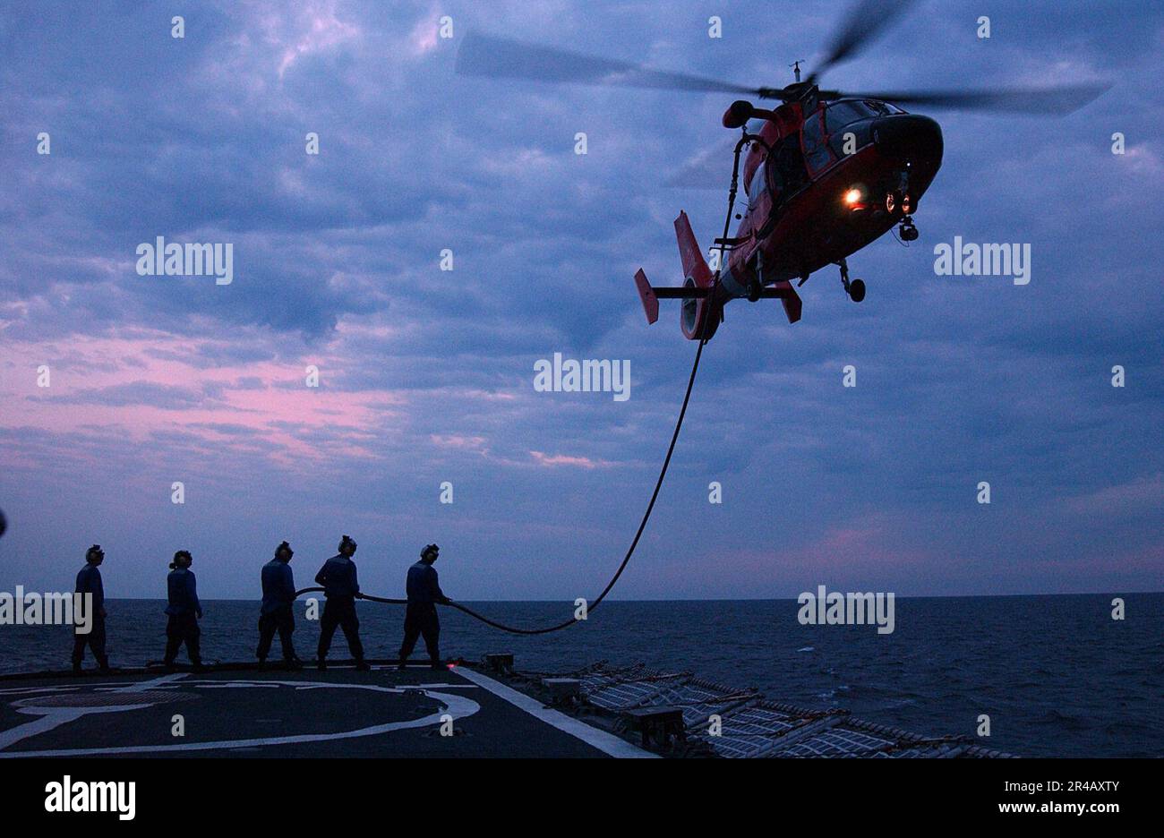 US Navy Crew members stationed aboard the U.S. Coast Guard Cutter ...