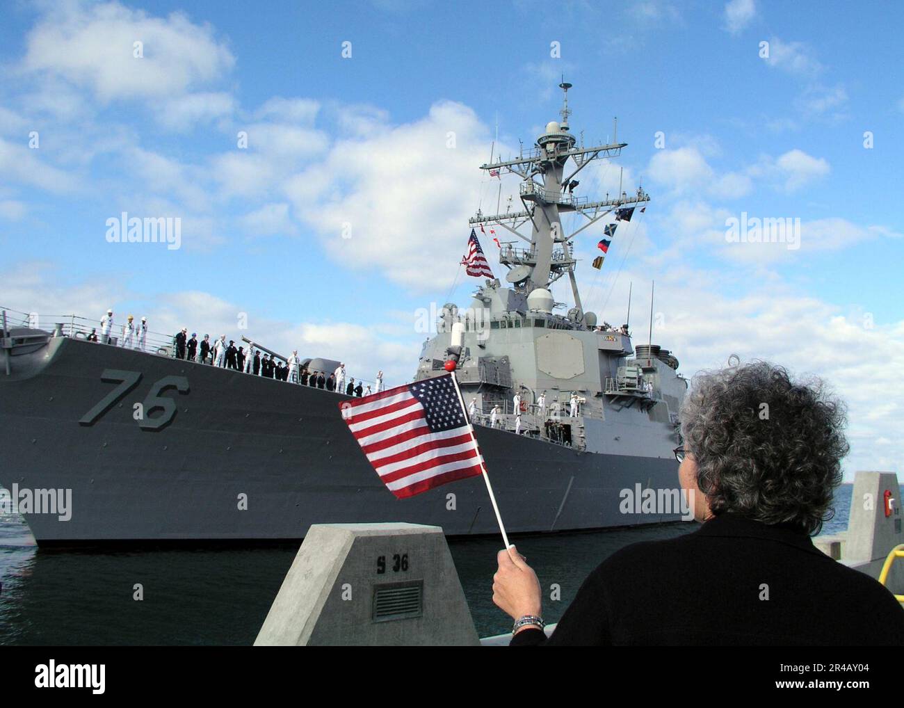 US Navy A family member waves her American Flag to show support for the ...