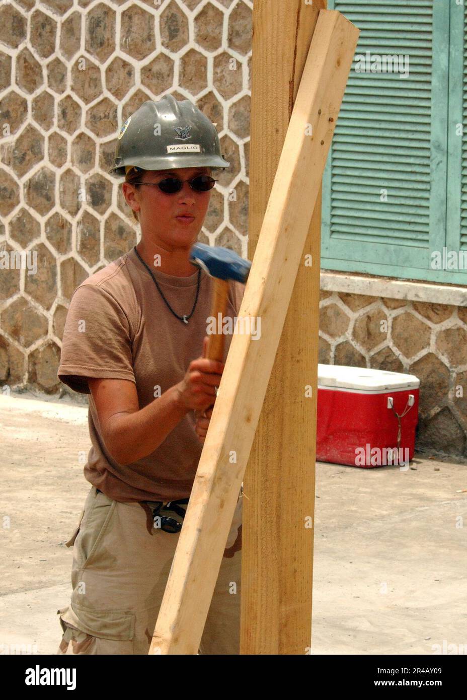 US Navy Builder 3rd Class assigned to Naval Mobile Construction ...