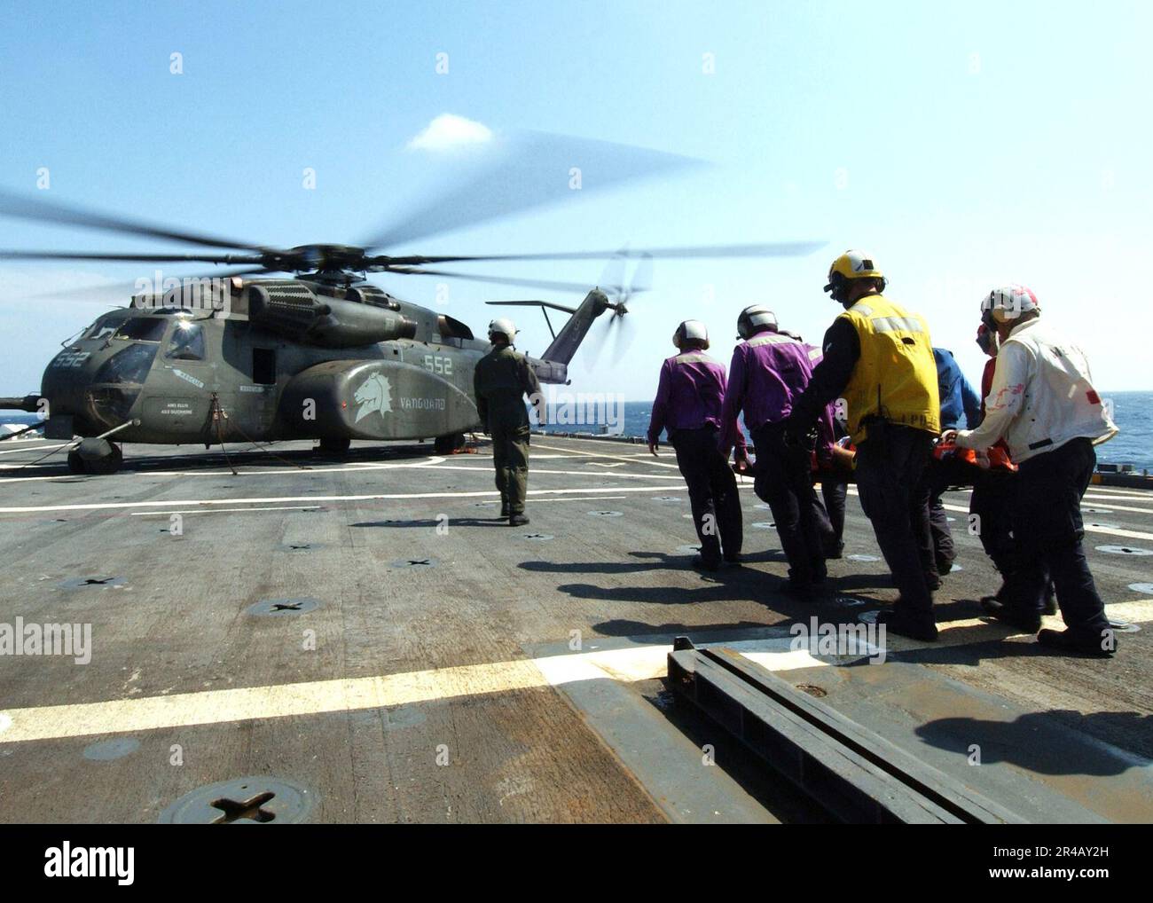 US Navy Stretcher bearers assigned to the amphibious transport dock ...