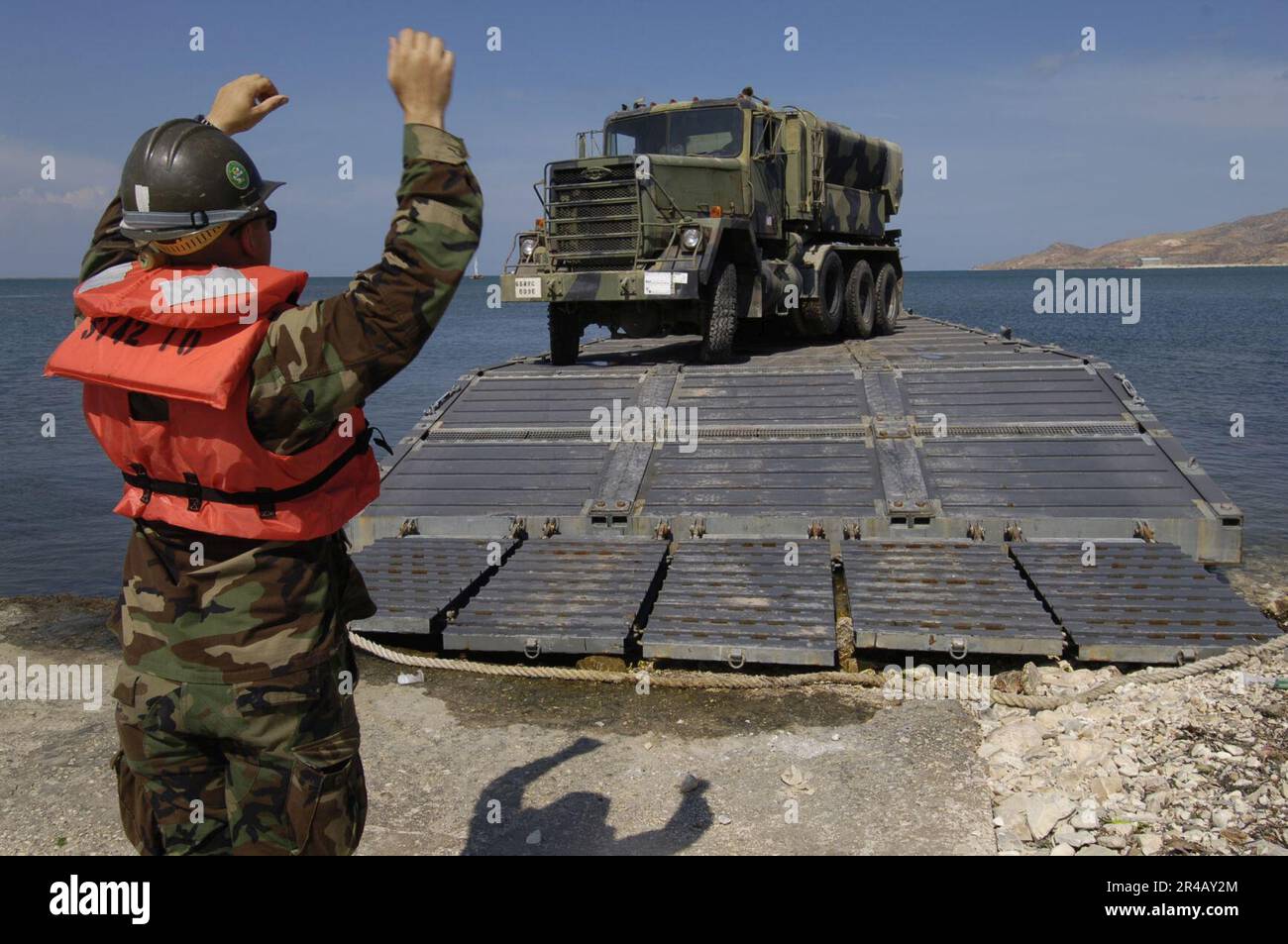 US Navy A Sailor assigned to the amphibious transport dock ship USS ...