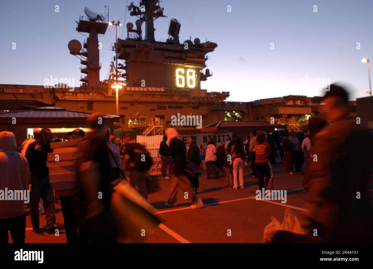 US Navy Family members look on as the crew board the nuclear powered ...