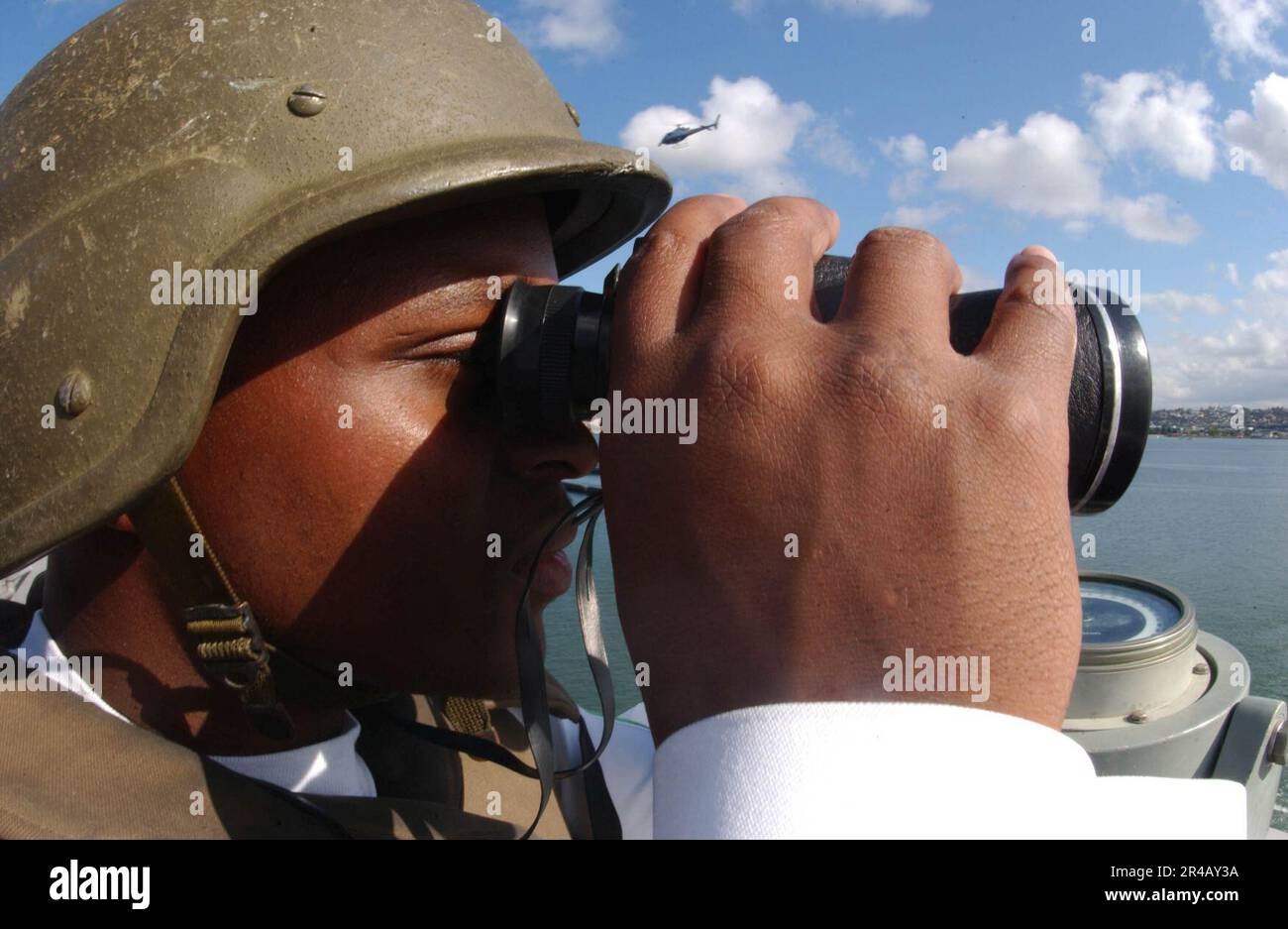 US Navy Aviation Ordnanceman Airman mans the starboard look out watch ...