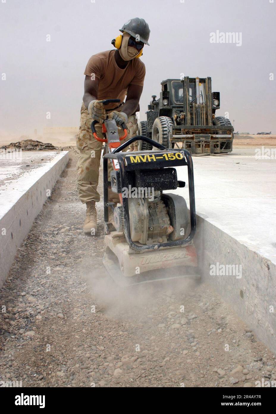 US Navy Builder 3rd Class assigned to Naval Mobile Construction ...