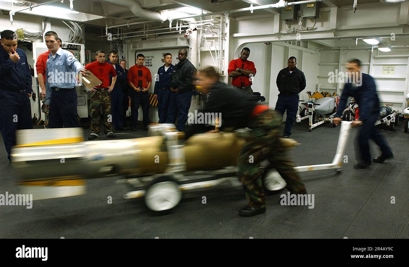 US Navy Aviation Ordnanceman stationed aboard the Nimitz- class ...
