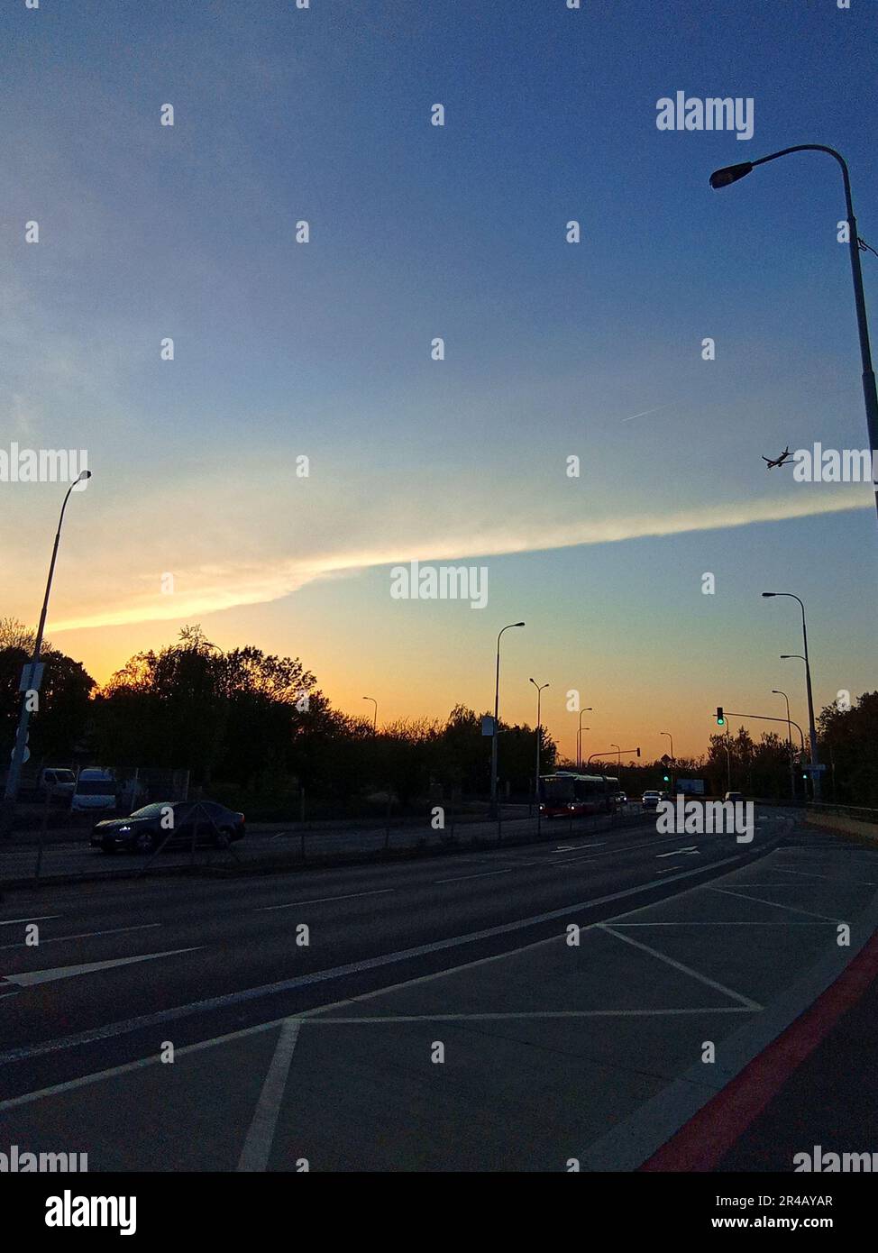 A street sign is visible at the end of a long stretch of highway ...