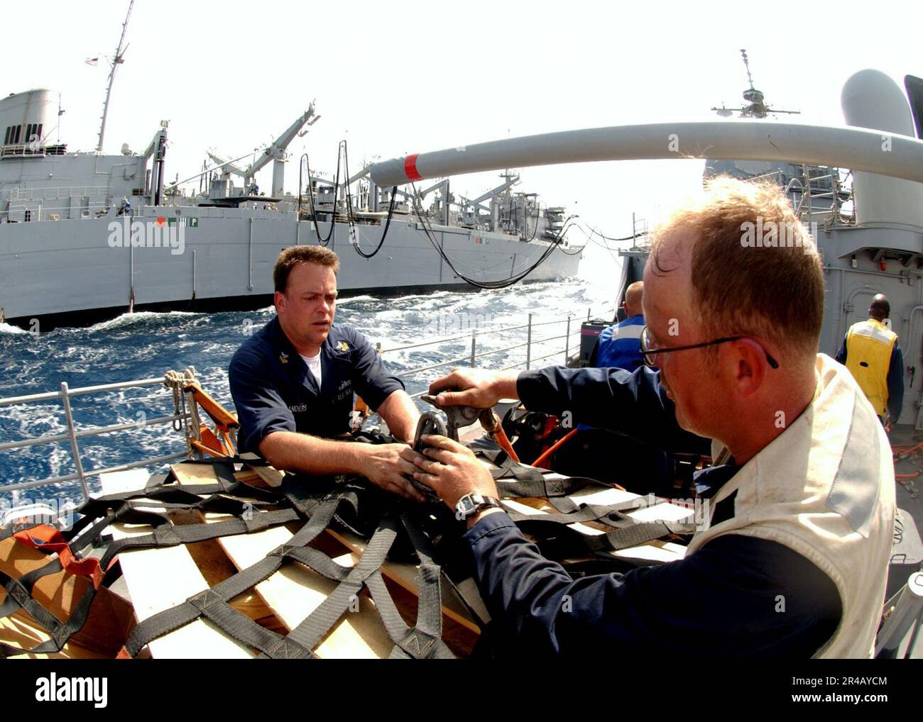 US Navy Fire Controlman 1st Class and Boatswain Mate 2nd Class assigned ...