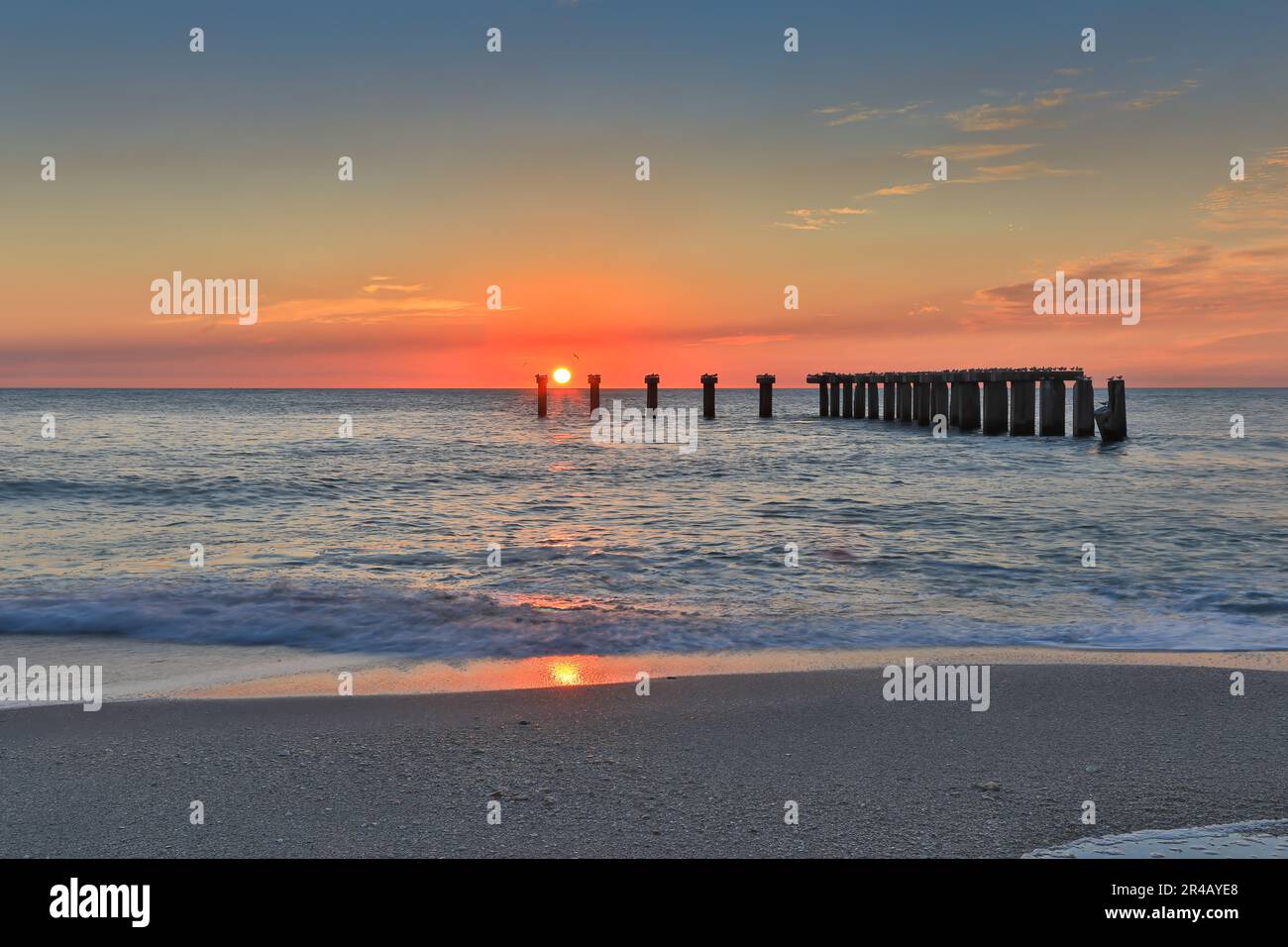 A stunning sunset in Boca Grande Island, Florida is illuminated on an ...