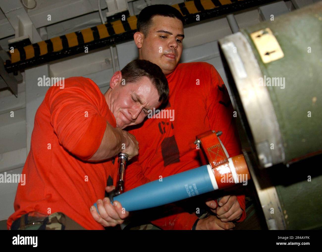 US Navy Aviation Ordnanceman install a WDU-4A-A inert air-launched 2.75 ...