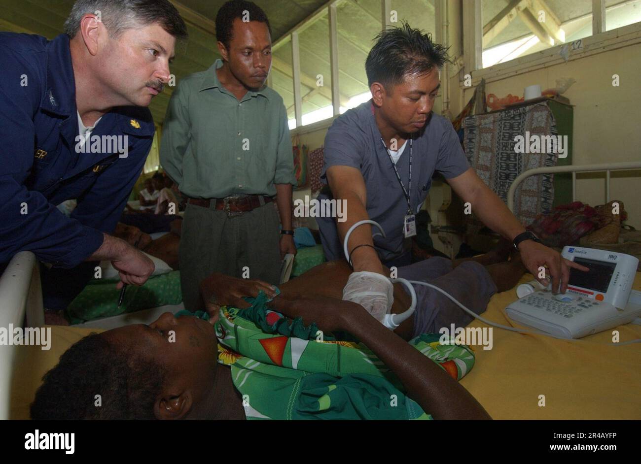US Navy Hospital Corpsman 2nd Class performs an ultra sound on a ...