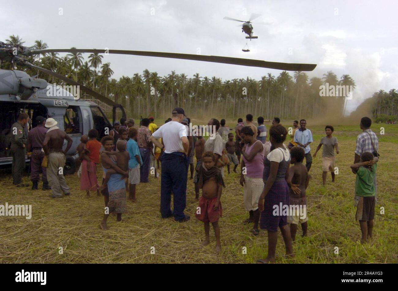 US Navy As one MH-60S Seahawk helicopter lands, crew members assigned ...