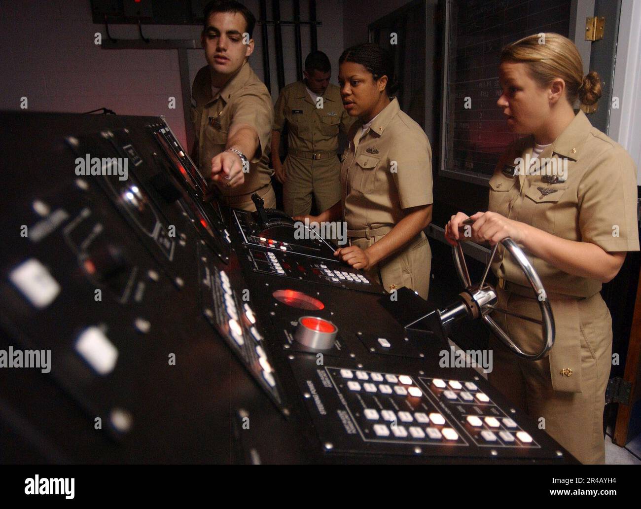 US Navy Lt. j.g. left, navigation instructor at the Naval Science ...