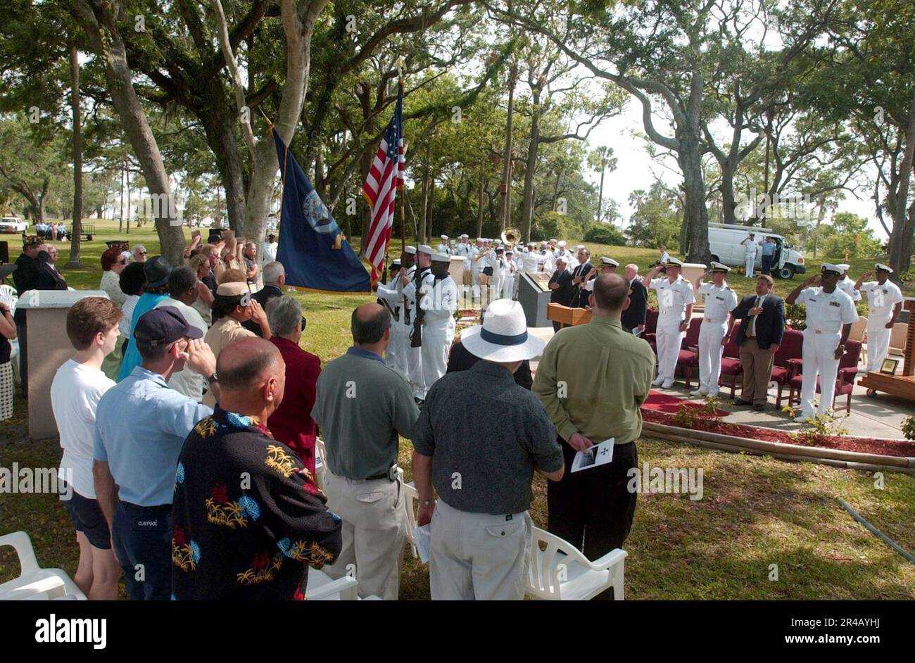 US Navy Military members and guests pay honors to the parading of the ...