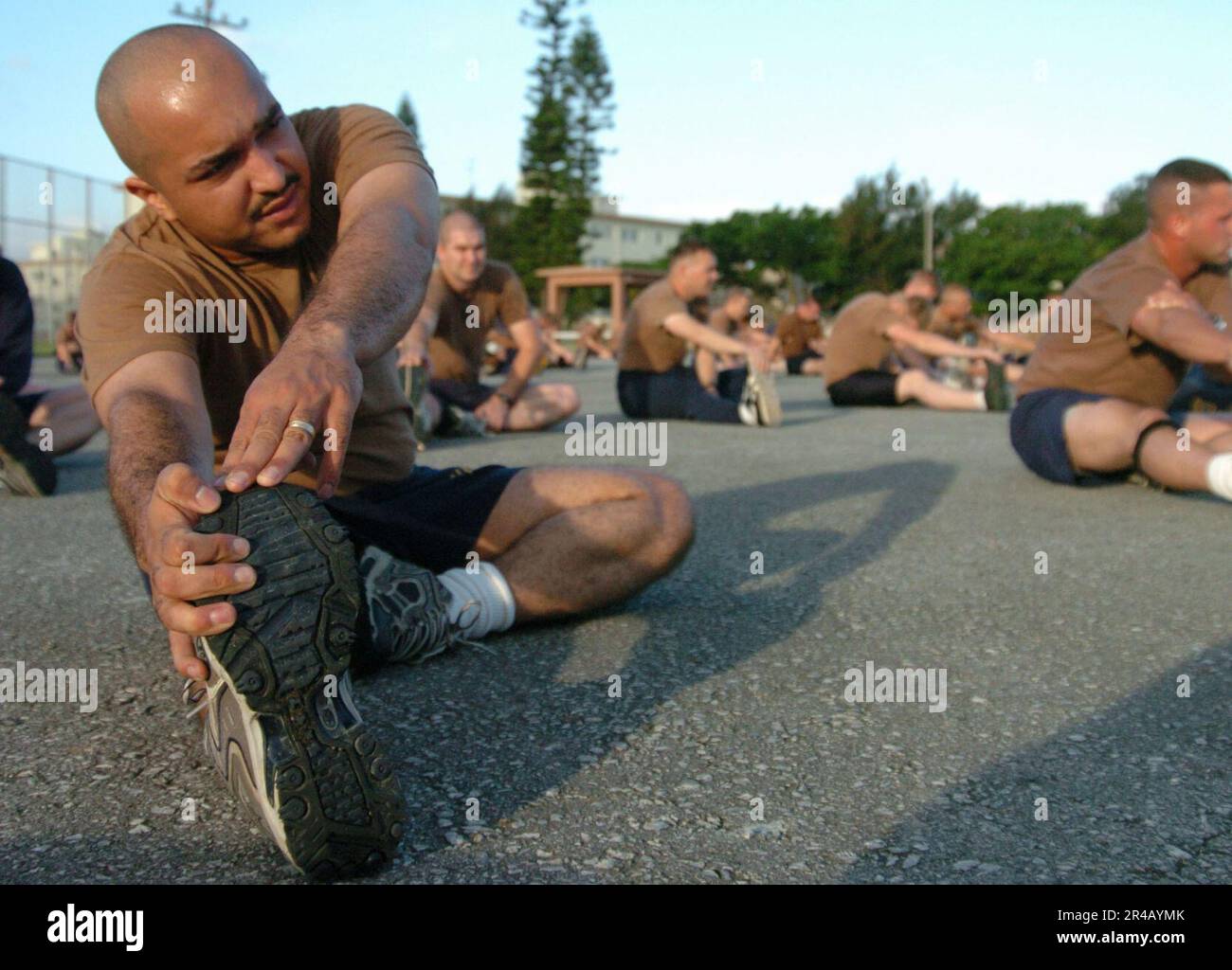 US Navy Equipment Operator 1st Class stretches after Naval Mobile ...