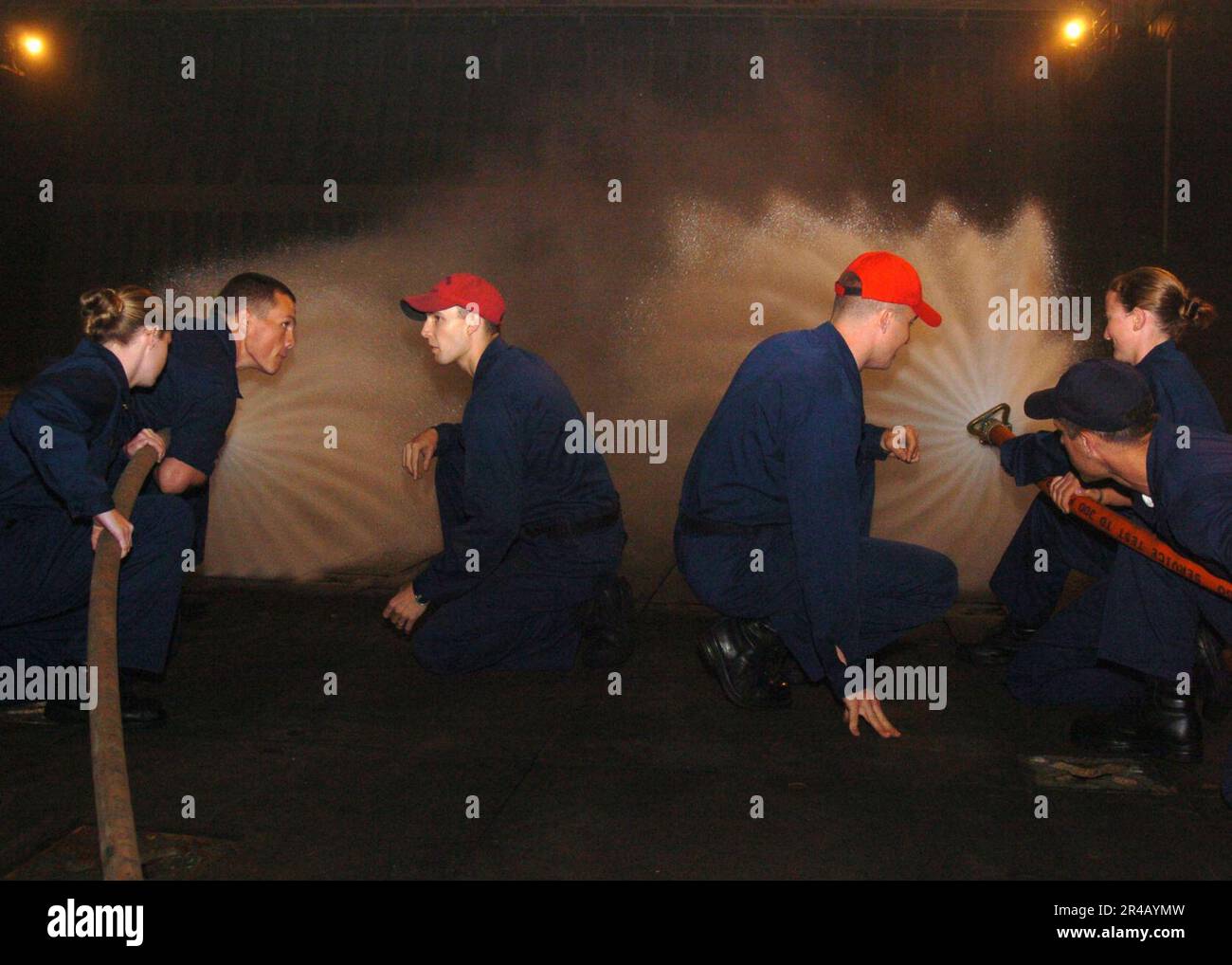 US Navy Damage Controlmen aboard USS Belleau Wood (LHA 3) instruct U.S ...