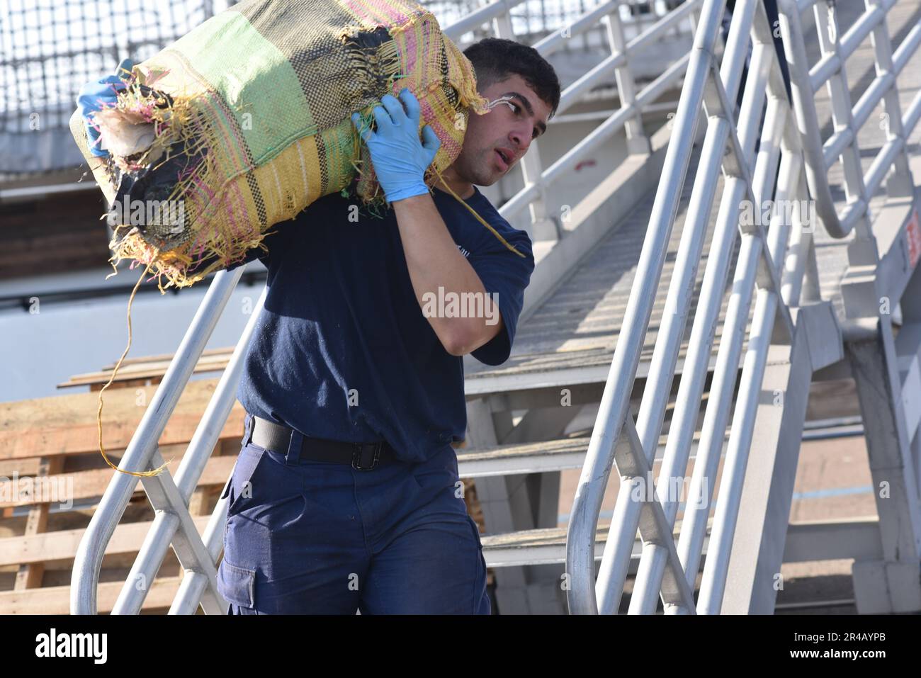 The Coast Guard Cutter Alert (WMEC-630) crew offloads approximately ...