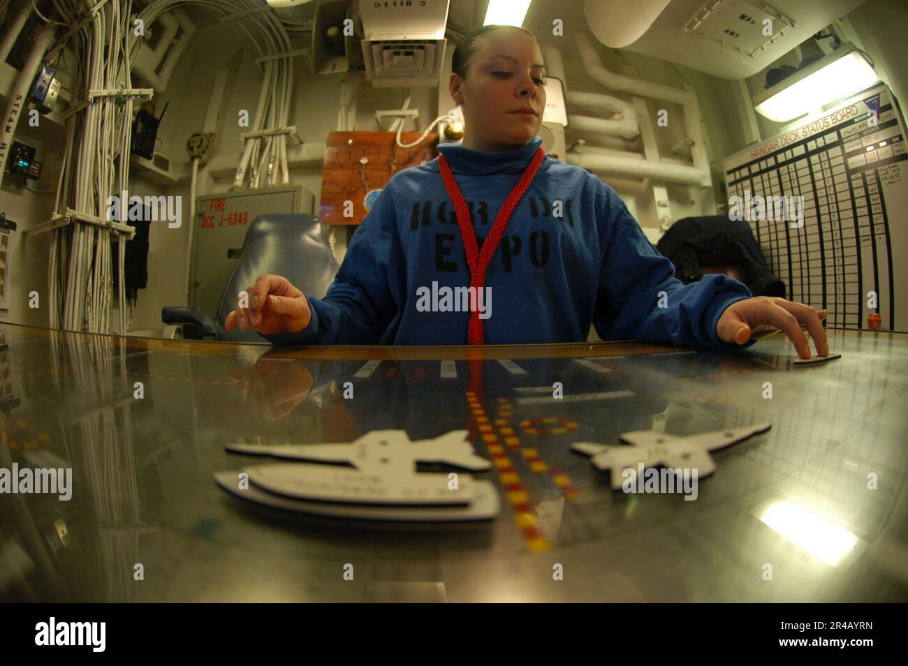 US Navy Aviation Boatswain's Mate 3rd Class uses a spotting board to ...