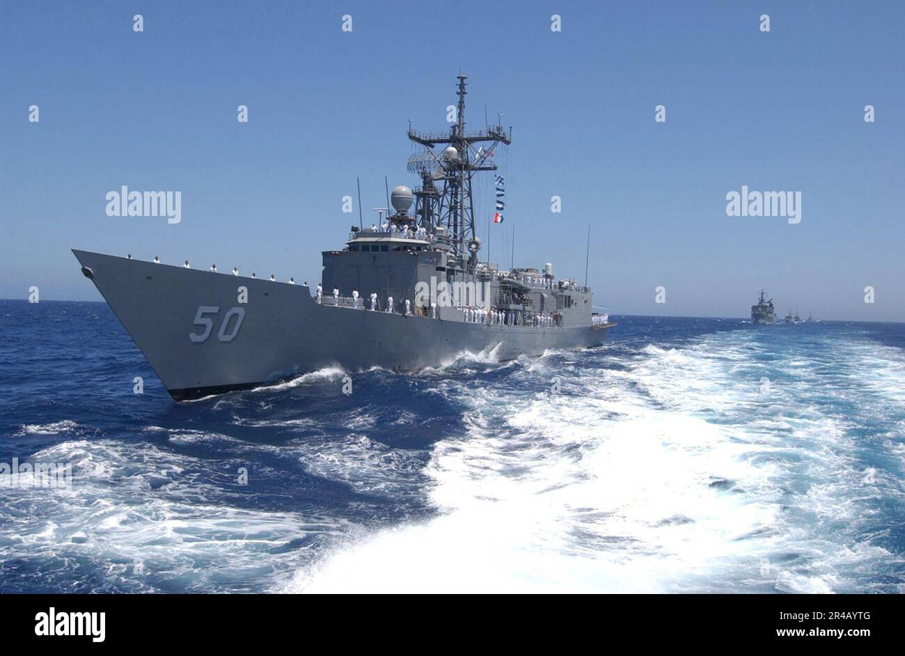 US Navy Crew members man the rail aboard USS Taylor (FFG 50) as the Standing NRF Maritime Group ...