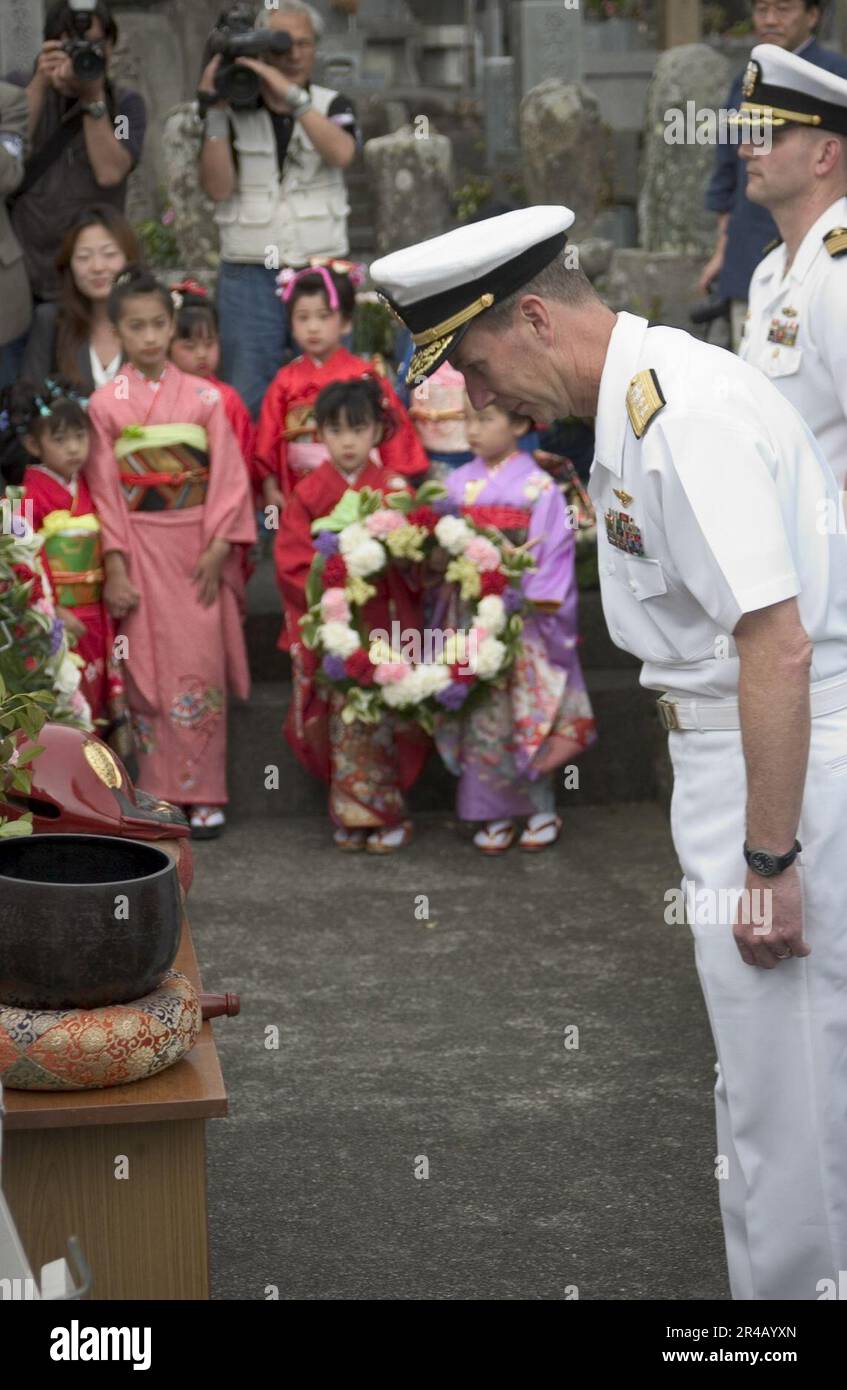 US Navy Commander Naval Forces Japan, Rear Admiral Frederic Ruehe bows ...