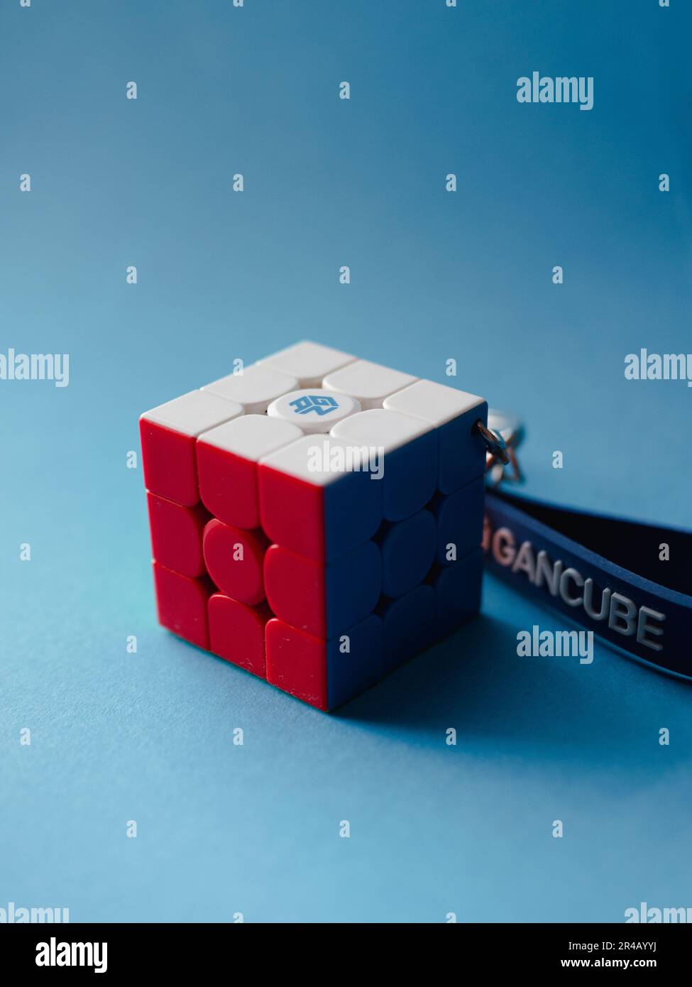 An iconic Gancube Rubik's Cube in red, white and blue colors sits atop ...