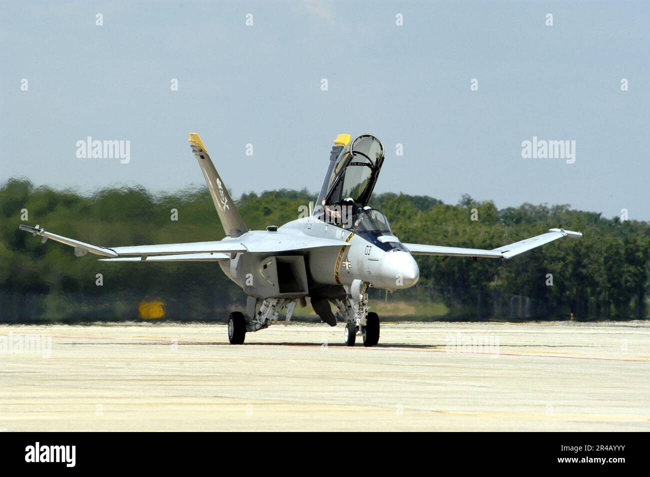 US Navy An F-A-18F Super Hornet flaps its outer wings as the aircrew ...