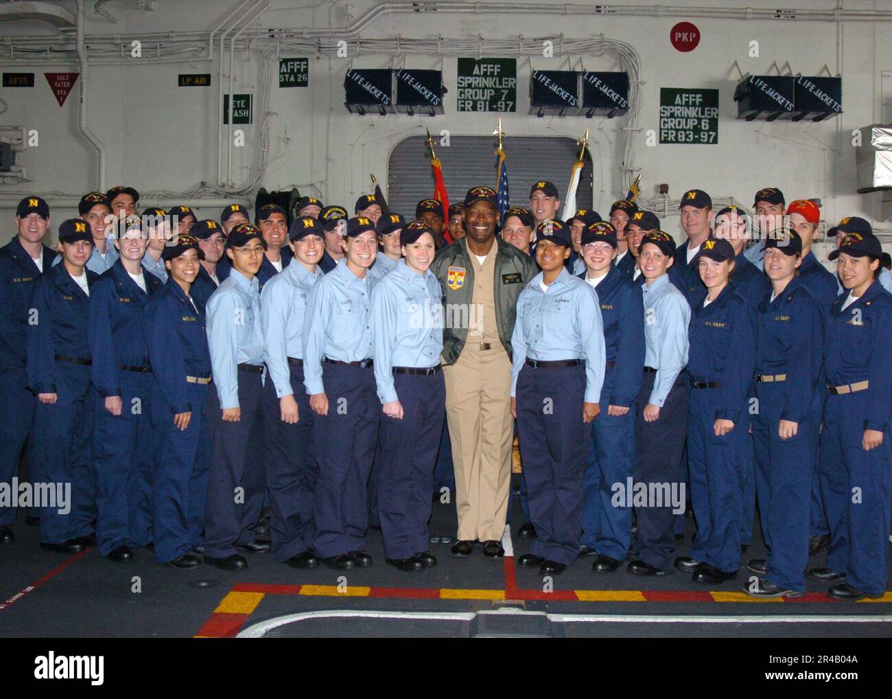 US Navy Midshipmen from the U.S. Naval Academy pose with USS Belleau ...
