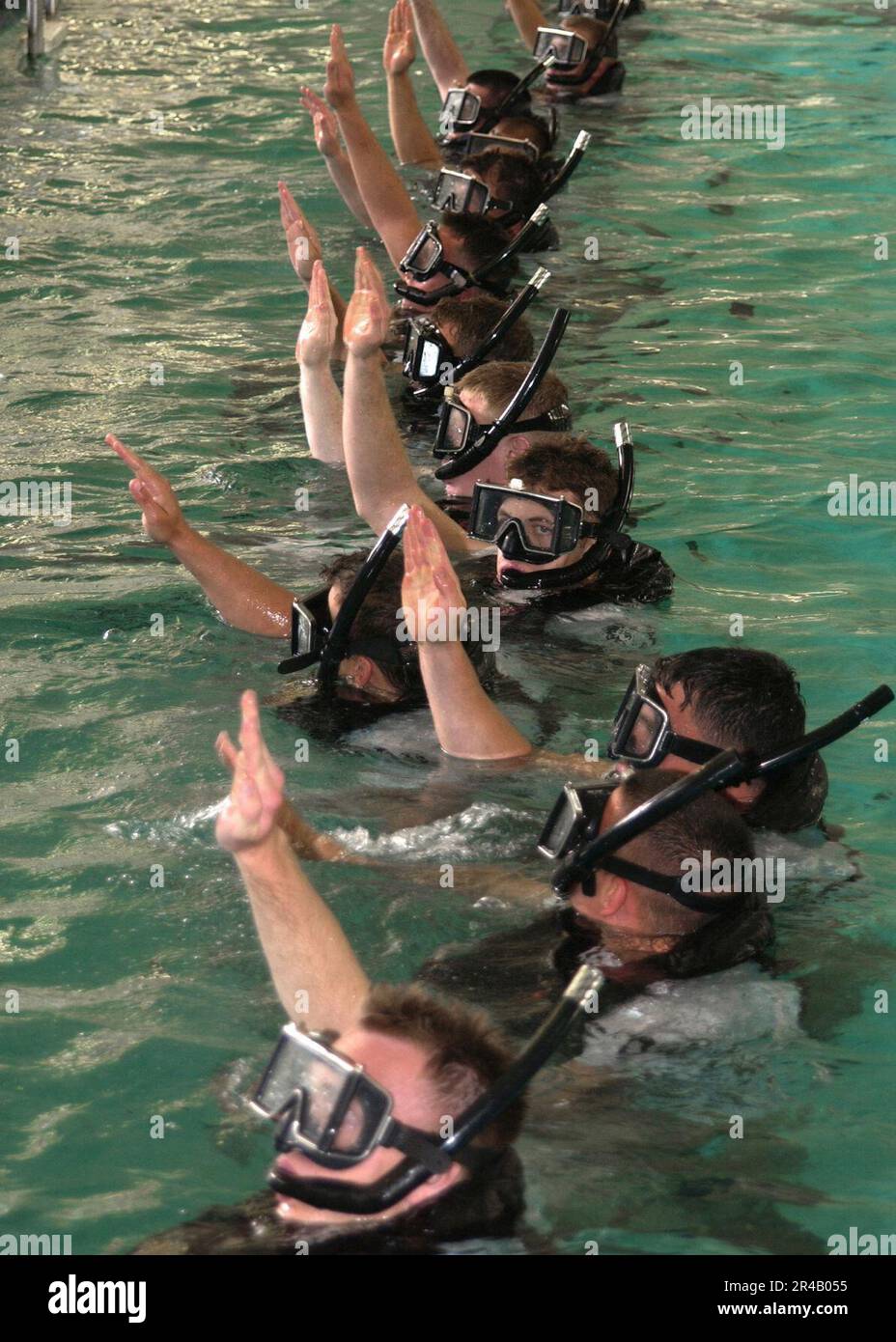 US Navy Search and Rescue (SAR) students give the I am all right signal ...