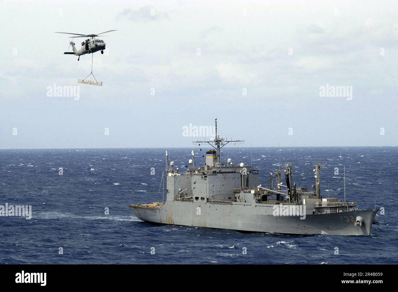 US Navy An MH-60S Seahawk helicopter transports supplies from the ...