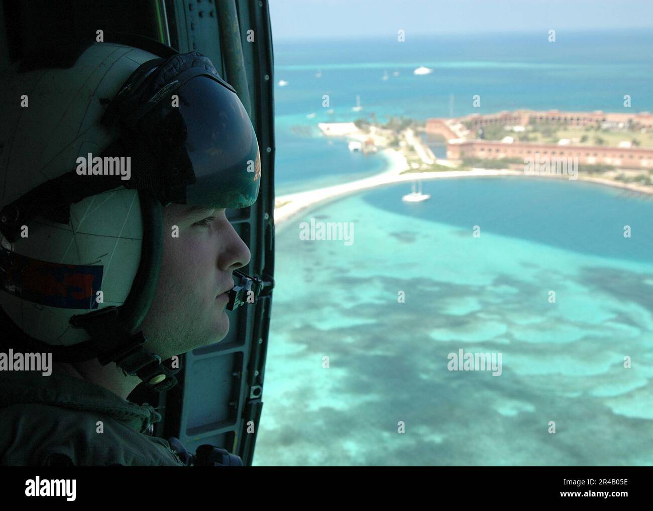 US Navy Aviation Machinist's Mate 2nd Class Keeps an eye on the waters ...